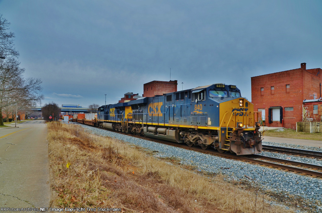 CSX 840 runs out from under the totally overcast sky.